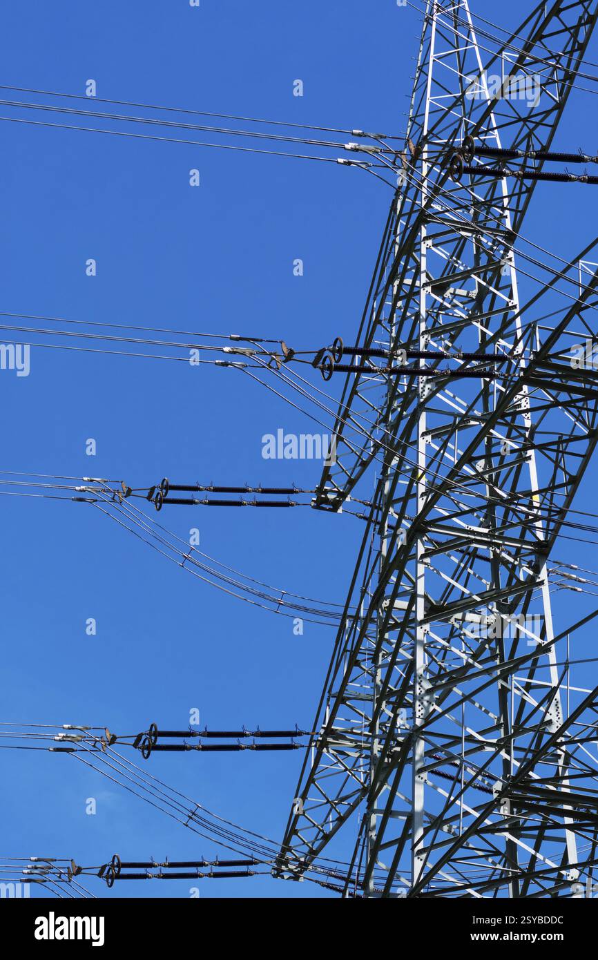 High-voltage line, electricity pylon in front of blue sky, energy ...