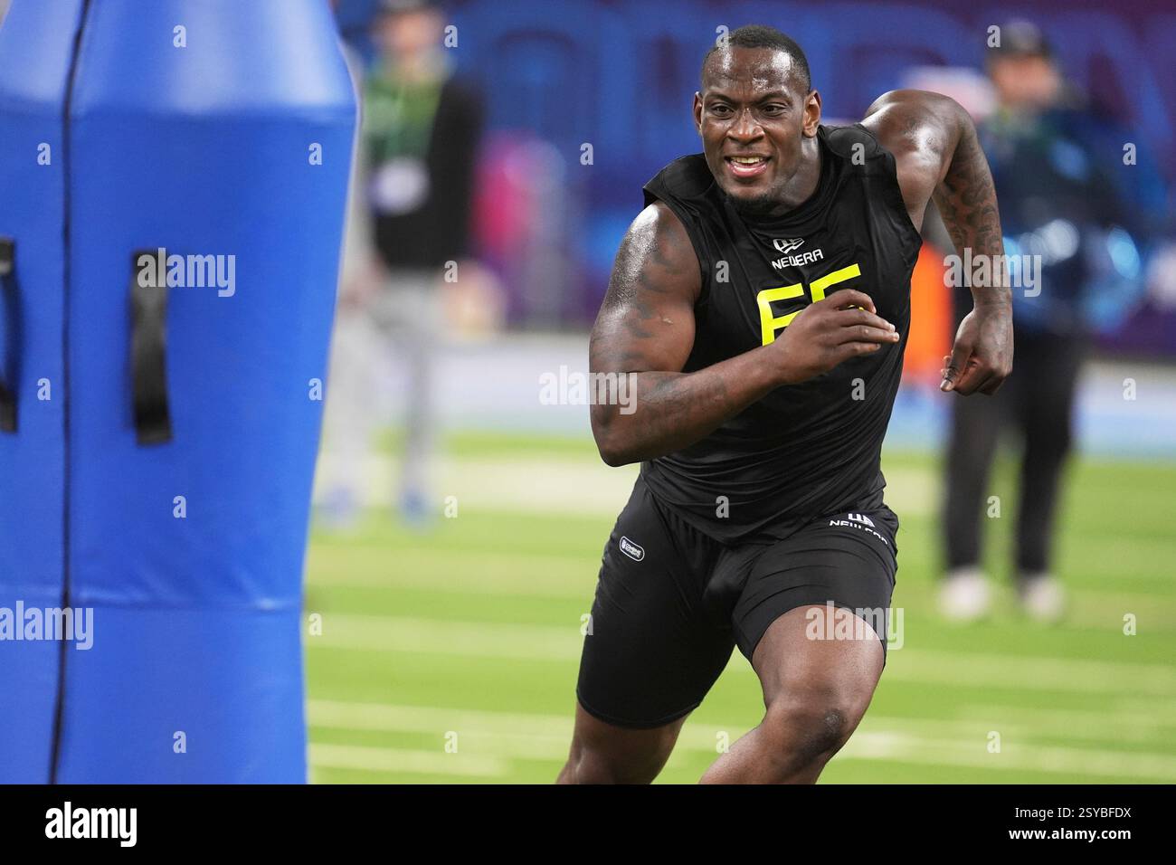 Texas A&M defensive lineman Nic Scourton runs a drill at the NFL ...