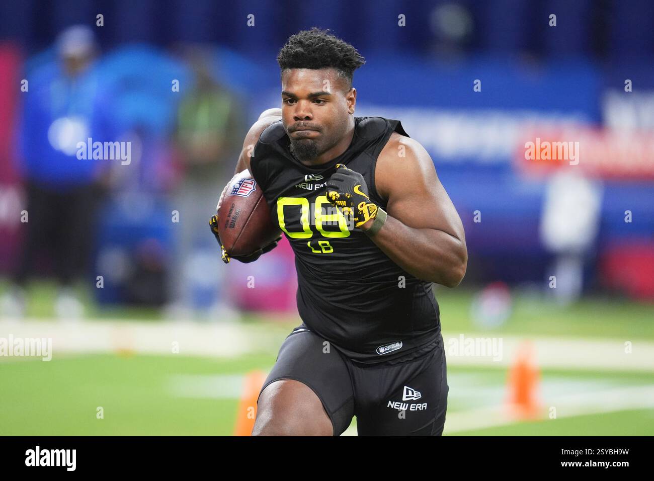Iowa linebacker Jay Higgins runs a drill at the NFL football scouting ...