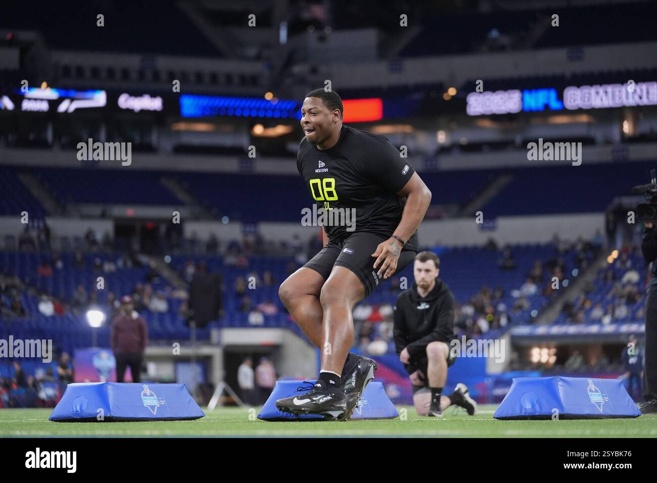 Texas defensive lineman Alfred Collins runs a drill at the NFL football ...