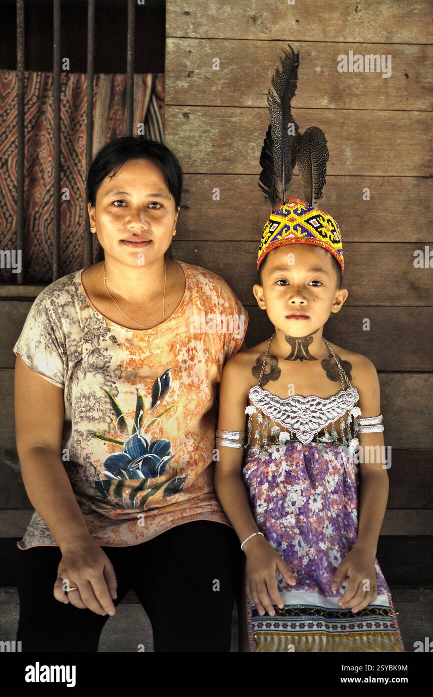 Portrait of a child in traditional attire, with temporary tattoos made ...