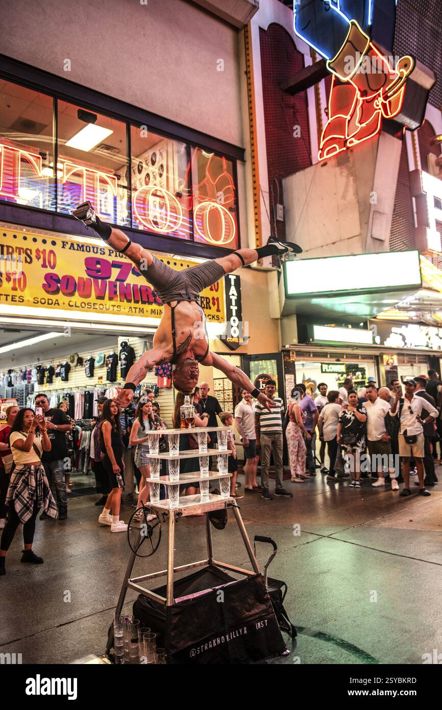 Street performer balancing on glasses, Freemont Street Experience Light ...