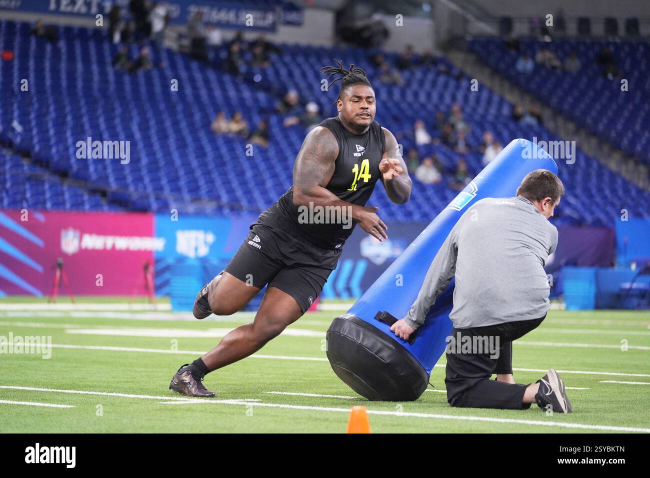 Ohio State defensive lineman Ty Hamilton runs a drill at the NFL ...
