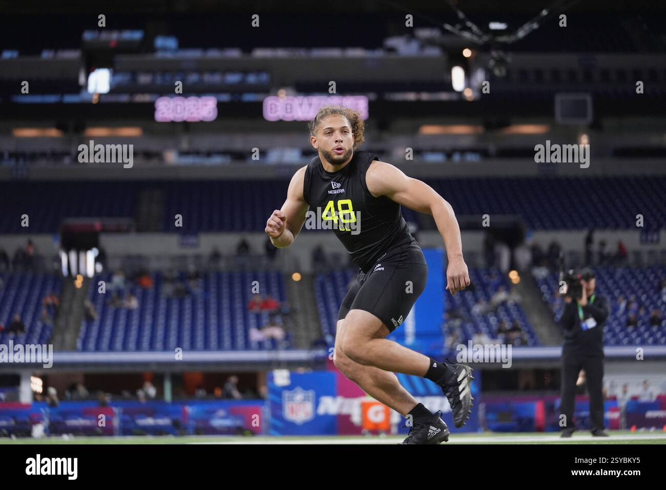 Louisville defensive lineman Ashton Gillotte runs a drill at the NFL ...
