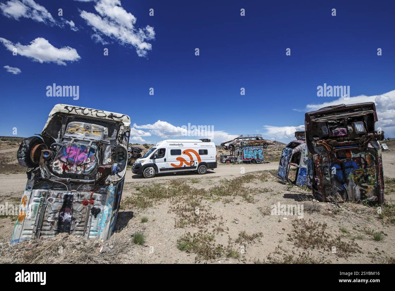 Motorhome and scrap cars decorated with graffiti in the Carforest of Goldfield, Nevada, USA ...