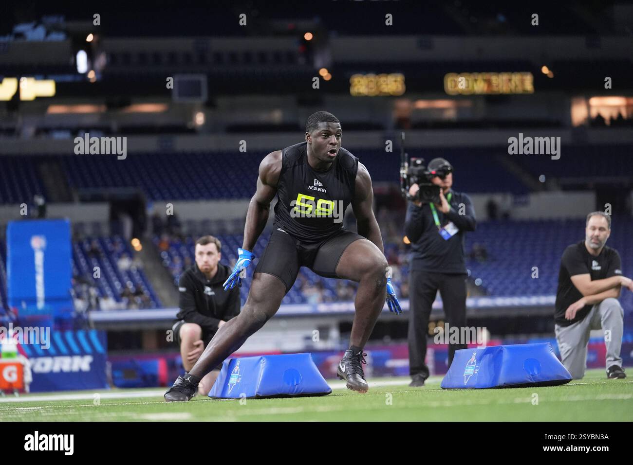 UCLA defensive lineman Oluwafemi Oladejo runs a drill at the NFL ...
