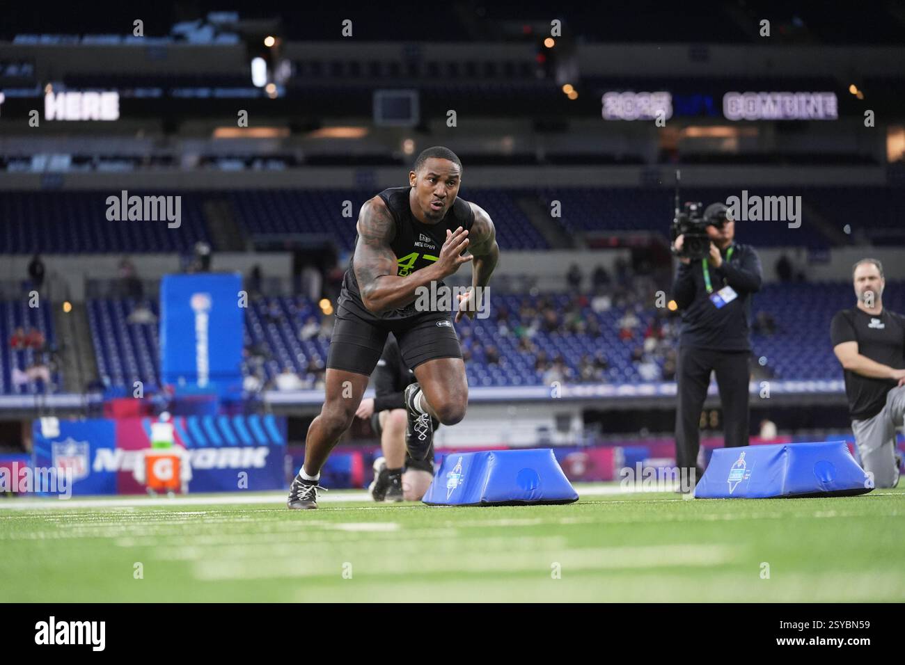 Boston College defensive lineman Donovan Ezeiruaku runs a drill at the ...