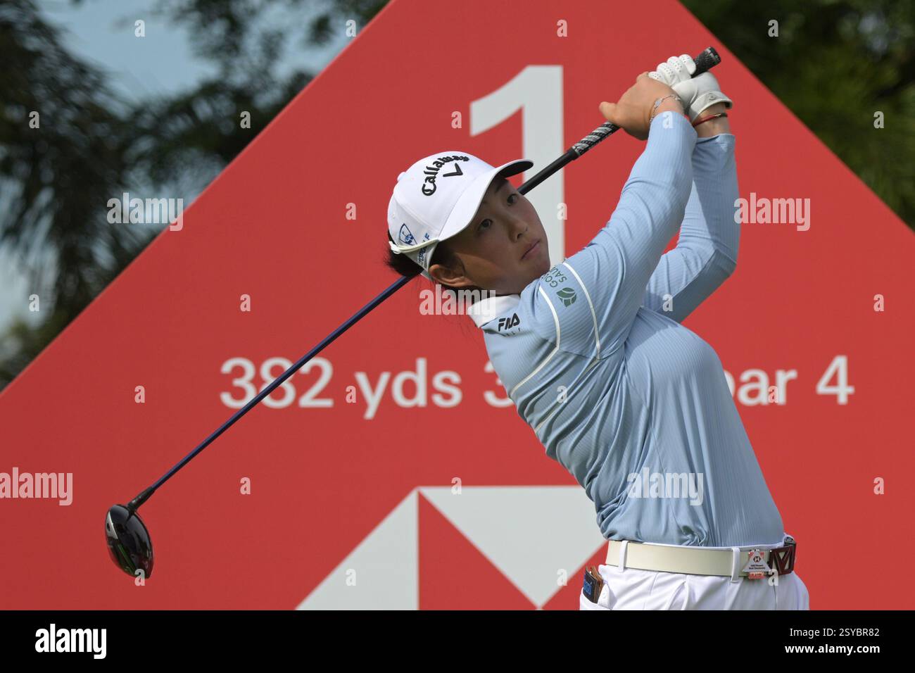 Singapore. 28th Feb, 2025. Yin Ruoning of China tees off during the ...