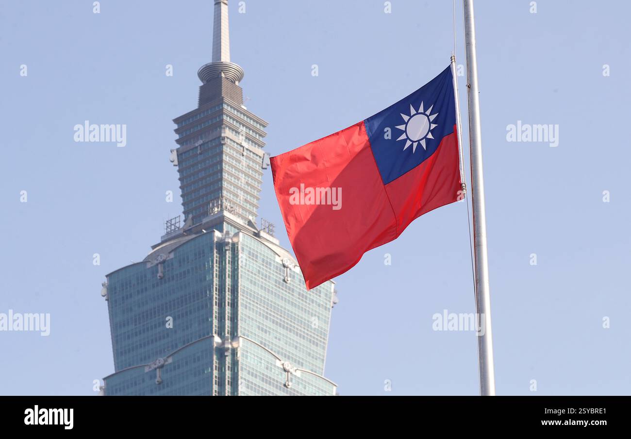 A Taiwan national flag flutters near the Taipei 101 building at the ...