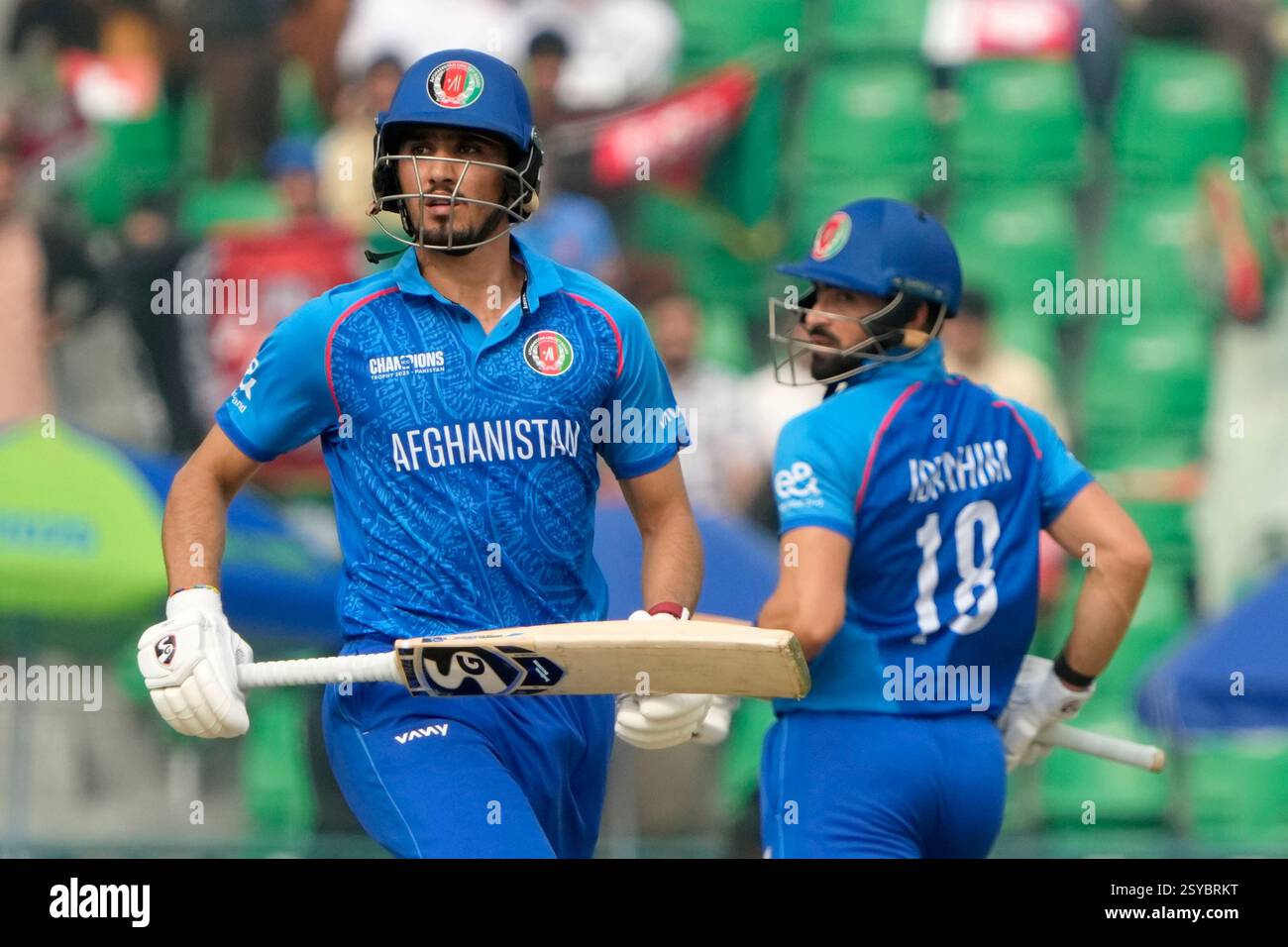 Afghanistan's Sediqullah Atal, left, and Ibrahim Zadran run between the wickets for score during ...