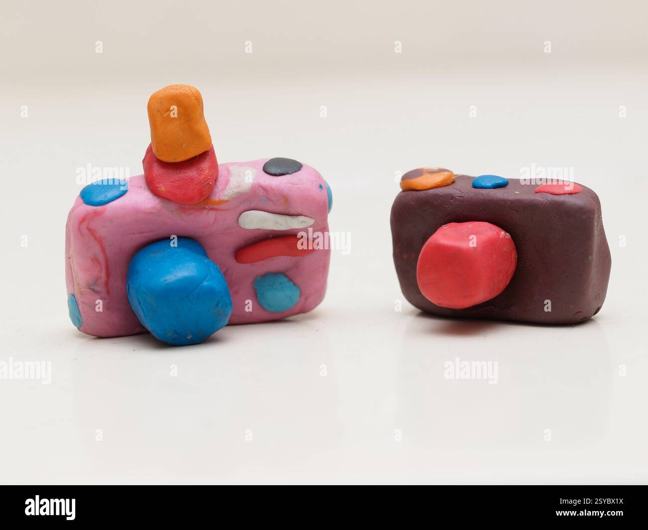A colorful and creative two clay cameras made by children Stock Photo ...