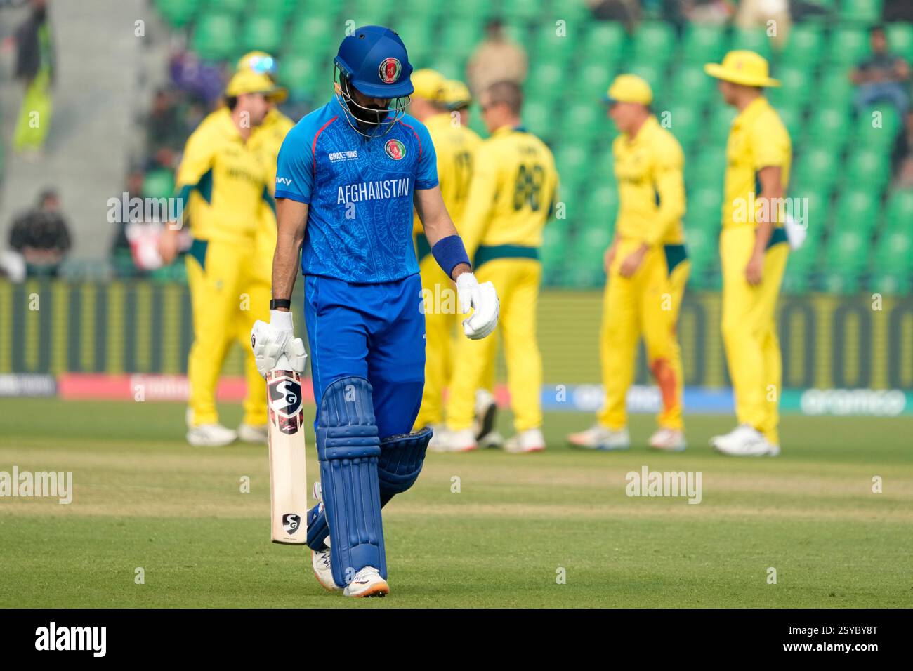 Afghanistan's Ibrahim Zadran walks off the field after his dismissal during the ICC Champions ...