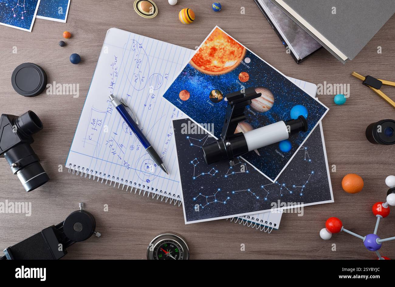 Astronomy student table with notebook with notes and calculations ...