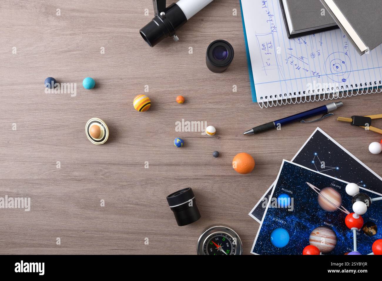 Astronomy student table with notes, photos and books, educational ...