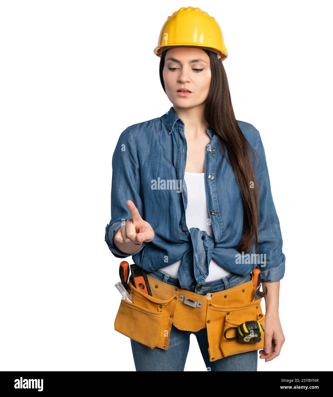 A female construction worker wearing a yellow hard hat and denim shirt ...