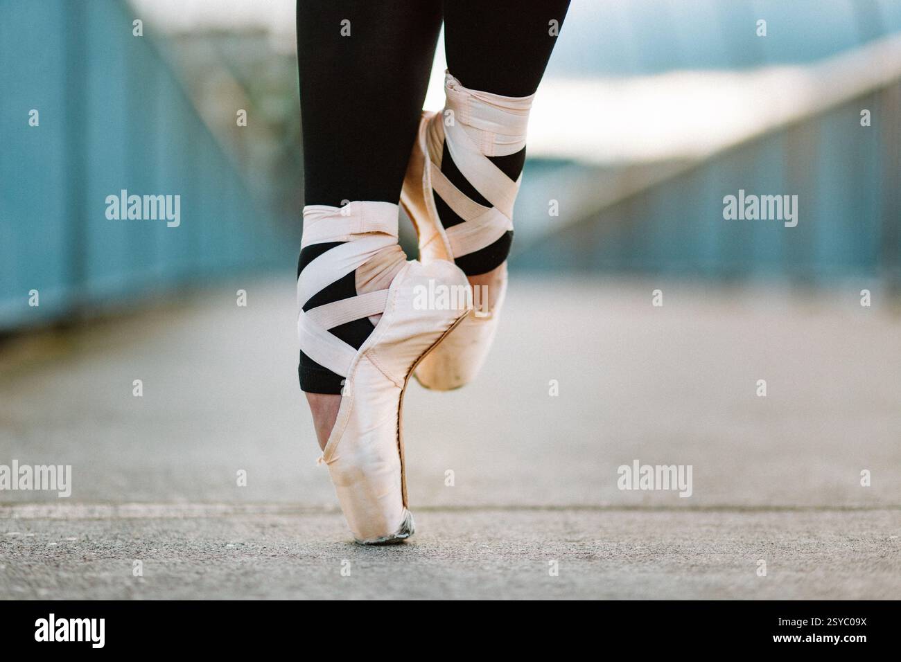 Ballet dancer en pointe on an urban bridge, showcasing elegance Stock ...