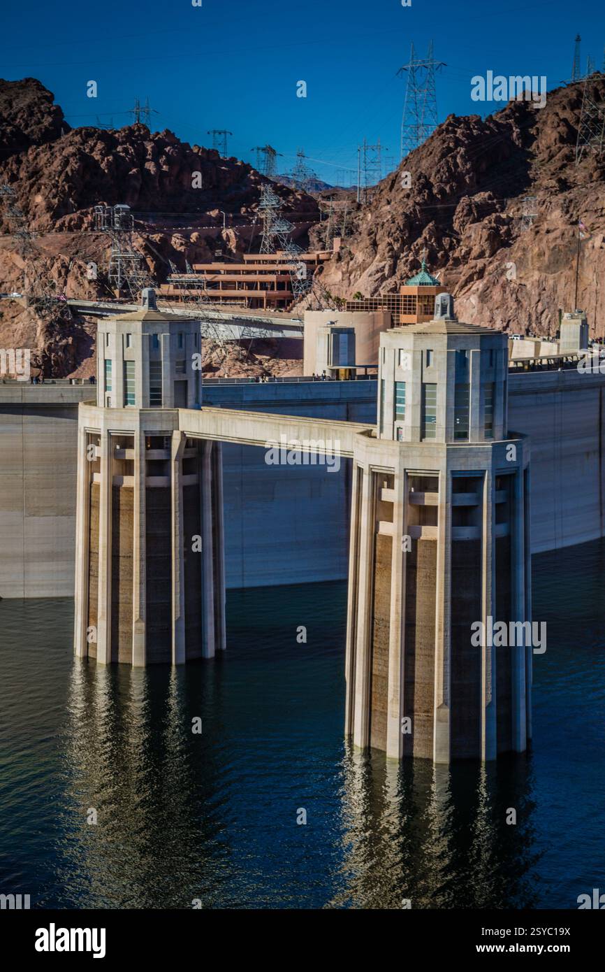 Bridge is over a body of water. The bridge is tall and has a lot of ...