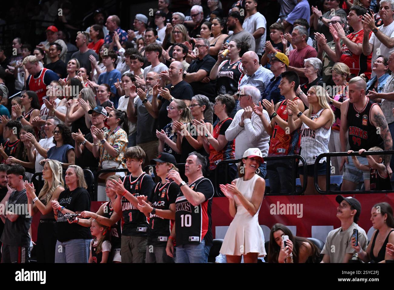 Hawks fans celebrate during game one of the NBL playoff series between ...