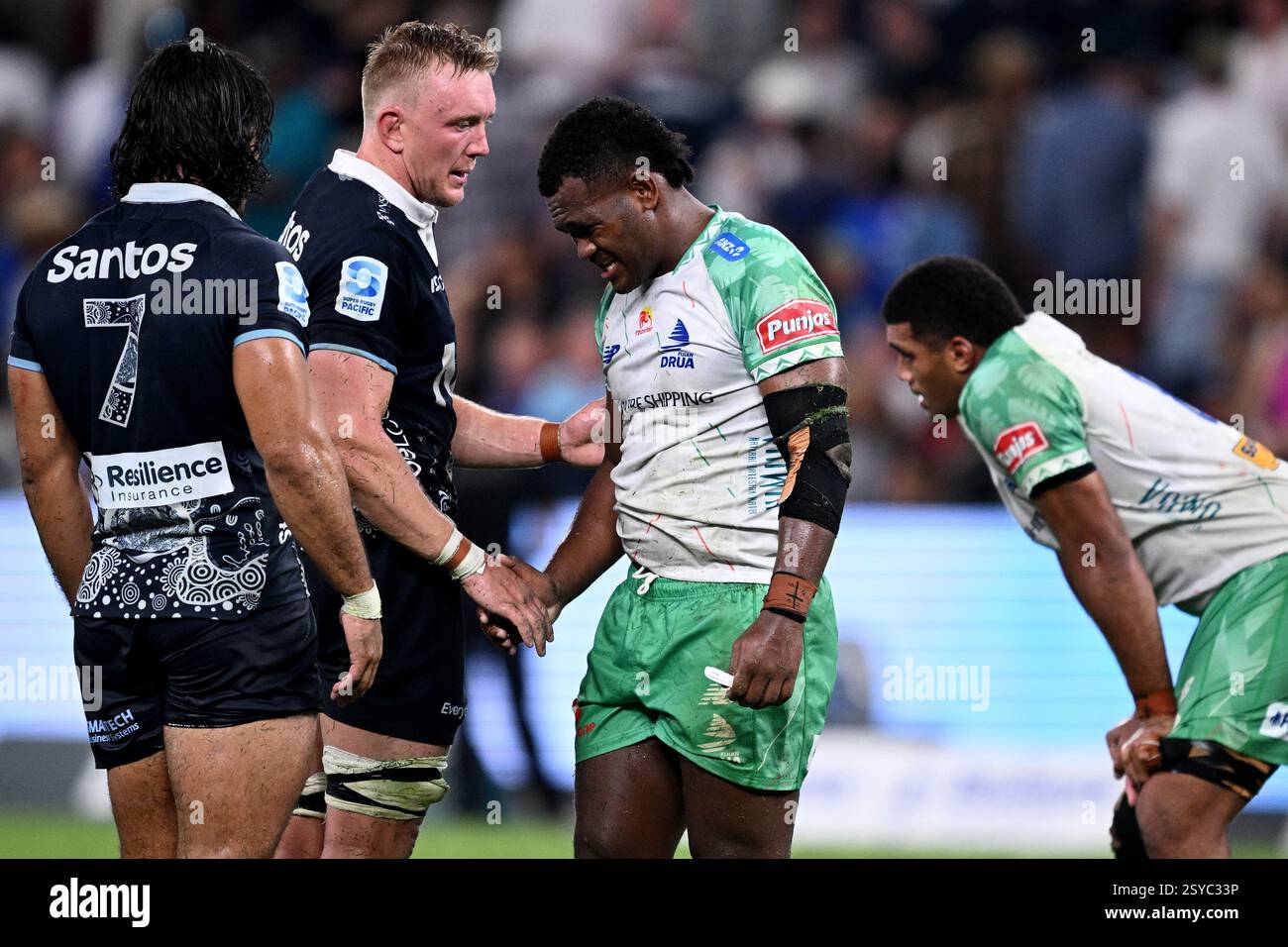 Inia Tabuavou of the Drua is consoled by Hugh Sinclair of the Waratahs ...