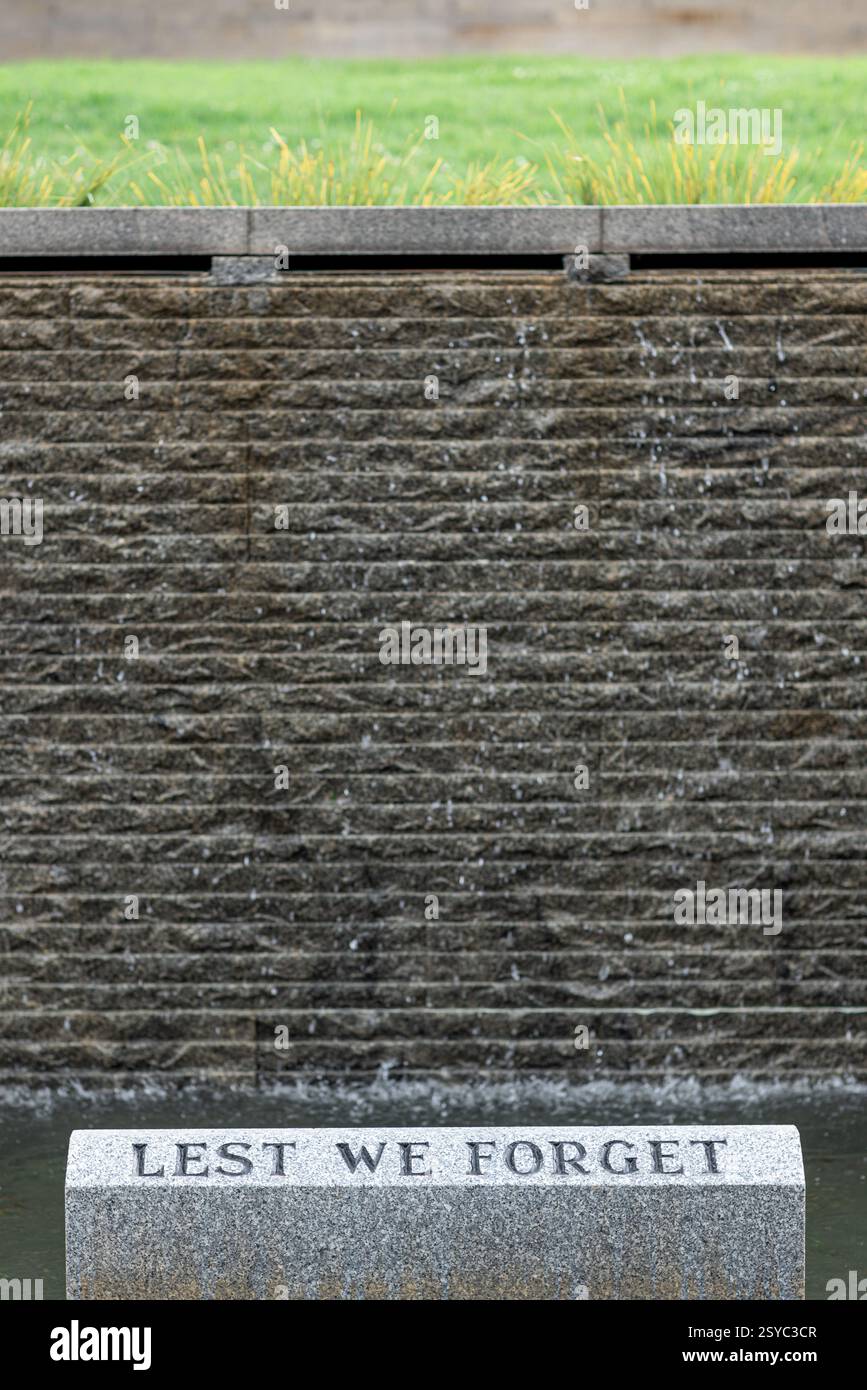 "Lest We Forget" inscription with water feature at war memorial Stock ...