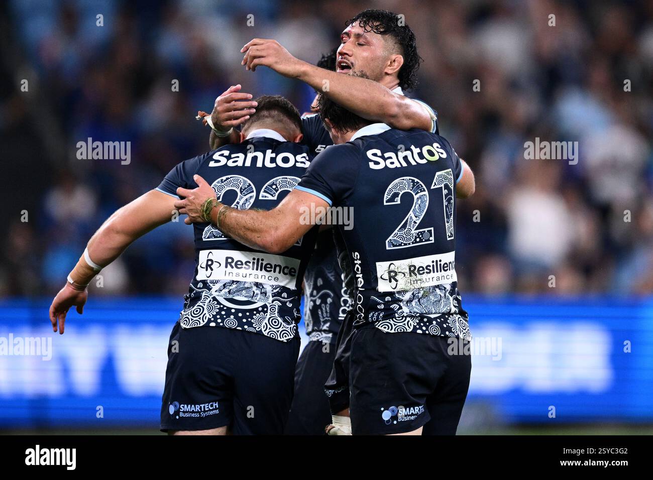 Rob Leota of the Waratahs (right) and teammates celebrate their win in ...