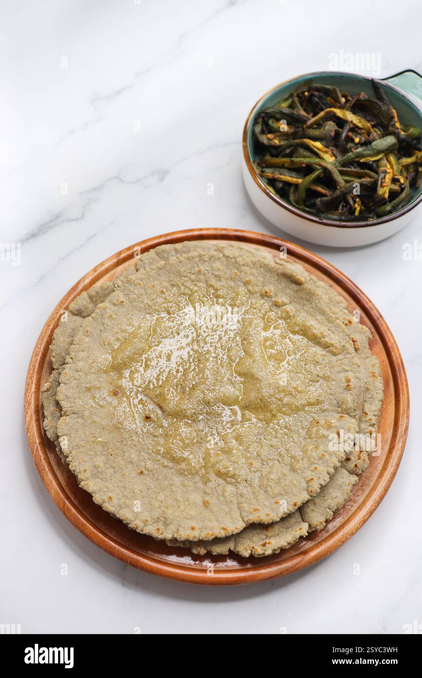 Roti and Sabzi. Indian vegetarian Thali includes bhindi fry, yellow ...