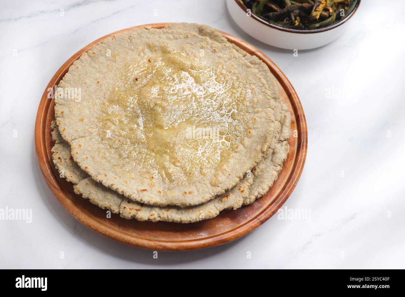 Roti and Sabzi. Indian vegetarian Thali includes bhindi fry, yellow ...