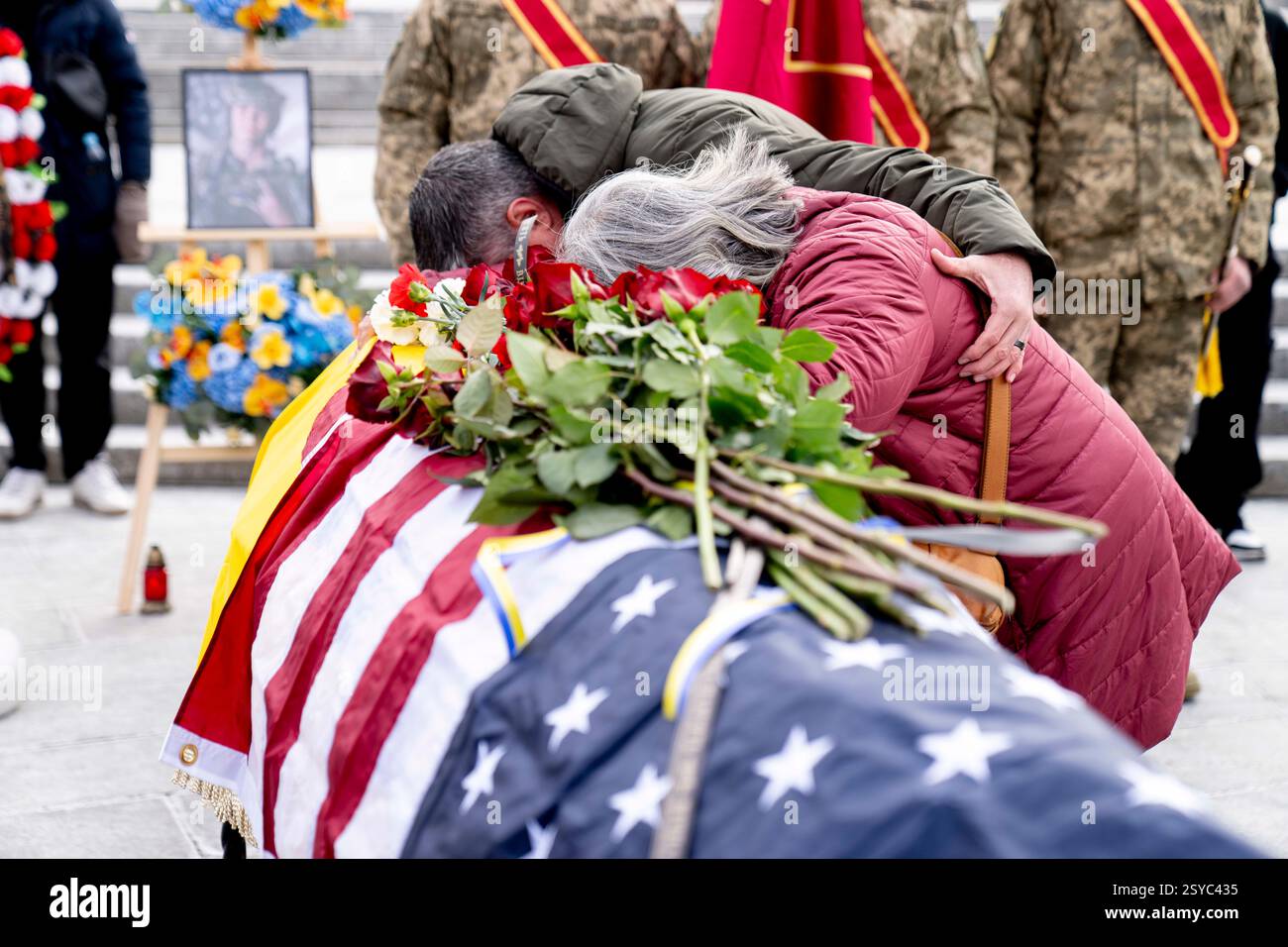Parents Leslie and John Hertweck seen mourning their son at memorial ...