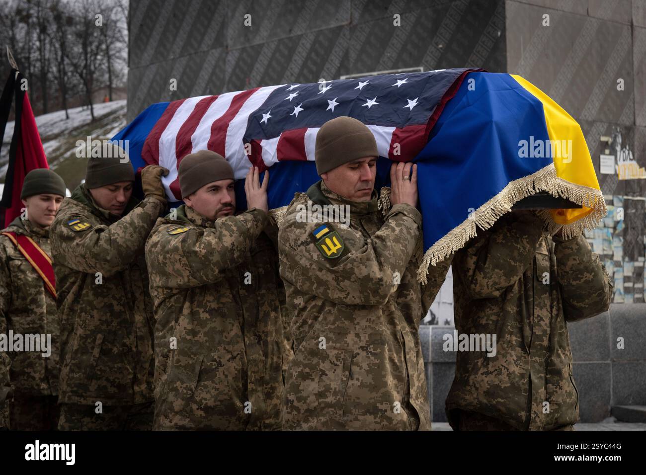Ukrainian soldiers carry the coffin of U.S. Marine Corps veteran Ethan ...