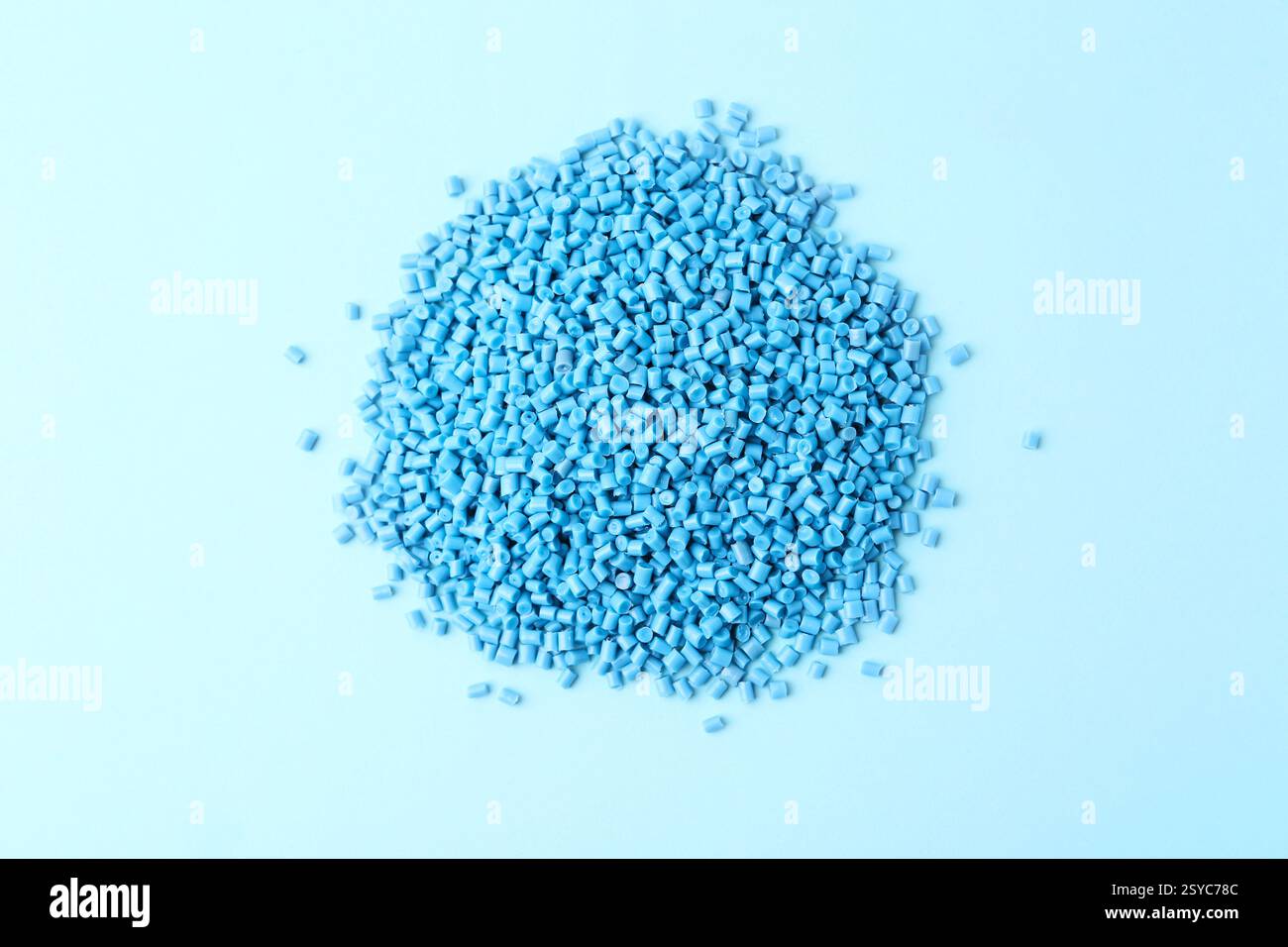 Pile of plastic granules on light blue background, top view Stock Photo ...