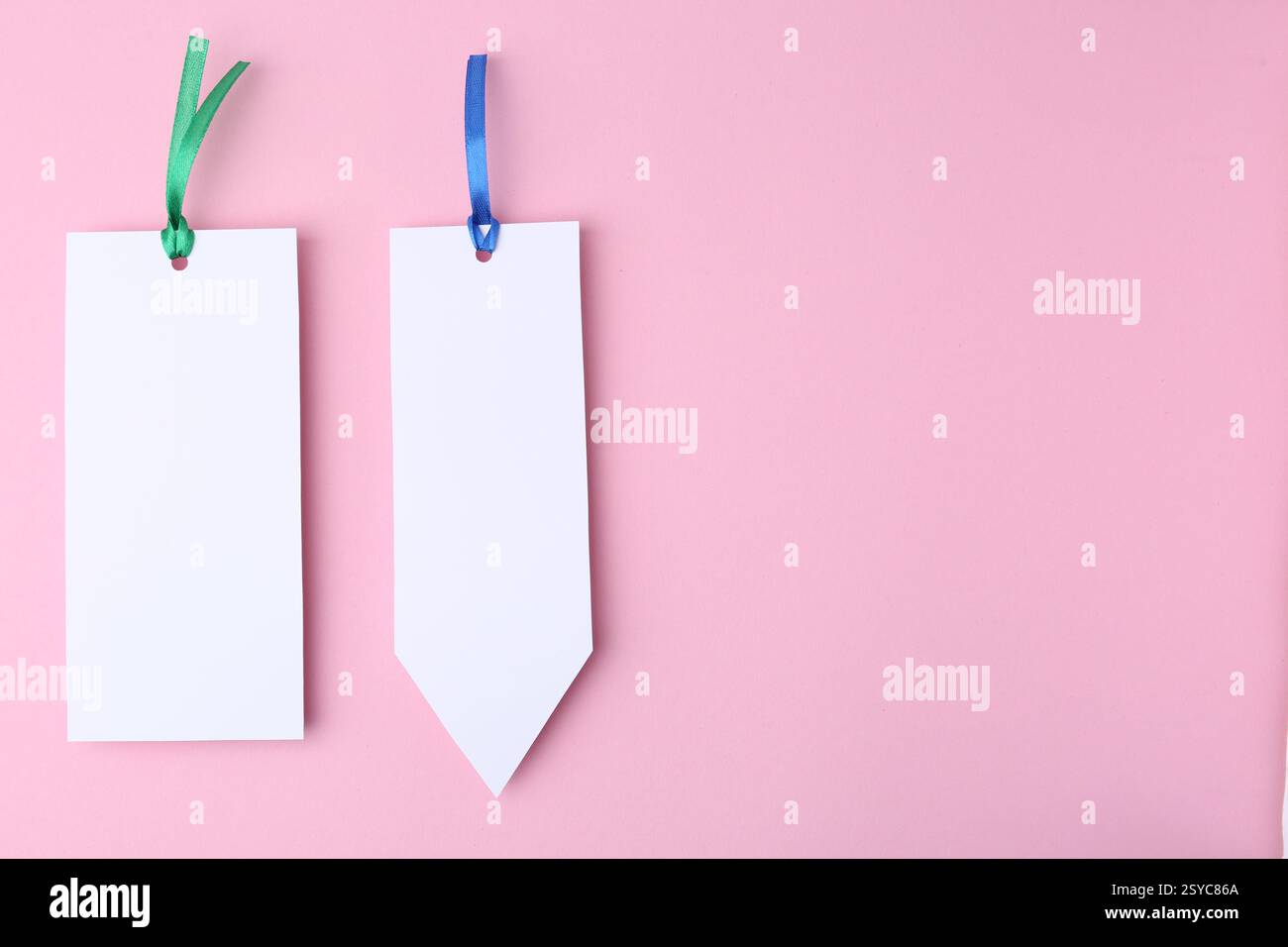 Paper bookmarks on pink background, top view. Space for text Stock ...