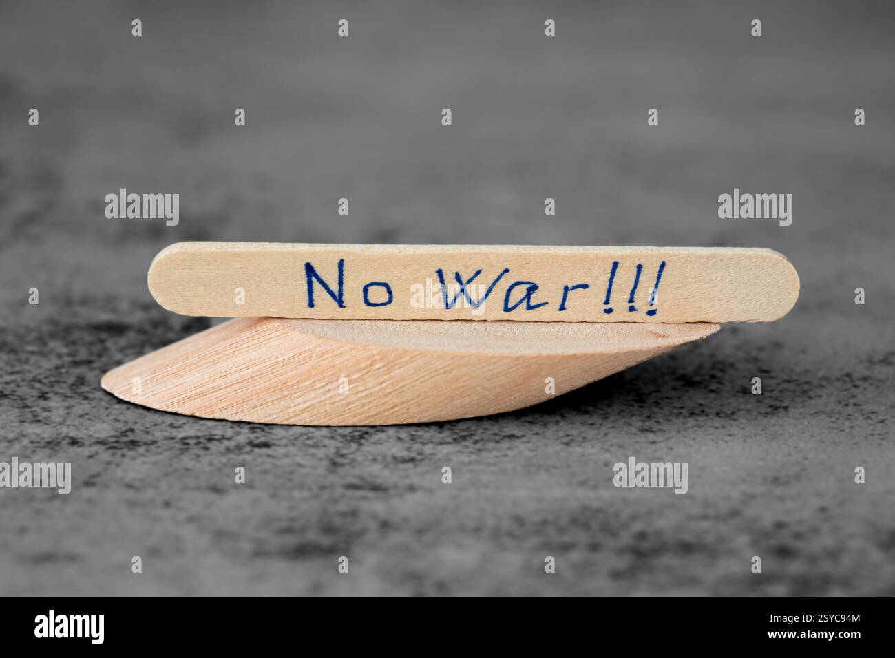 No war text on the wooden long board on the gray background. No war ...