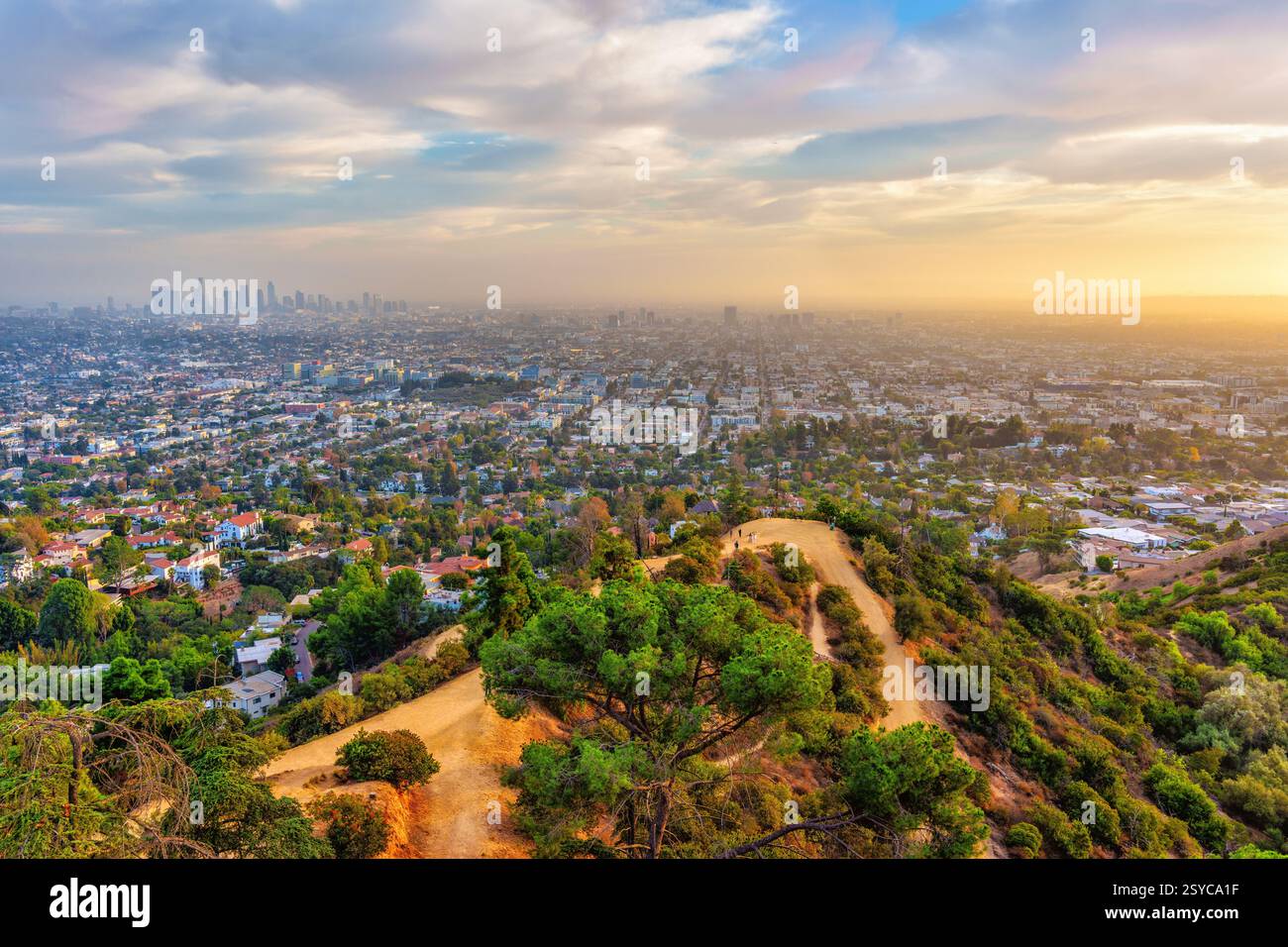 Gorgeous sunset illuminating the Los Angeles skyline as hikers enjoy ...