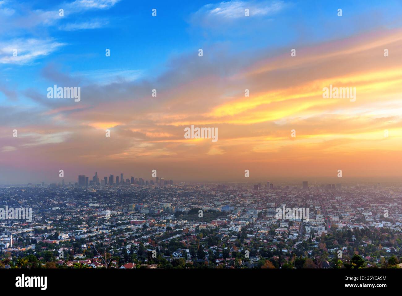 Stunning sunset with orange and pink skies over Los Angeles, featuring ...