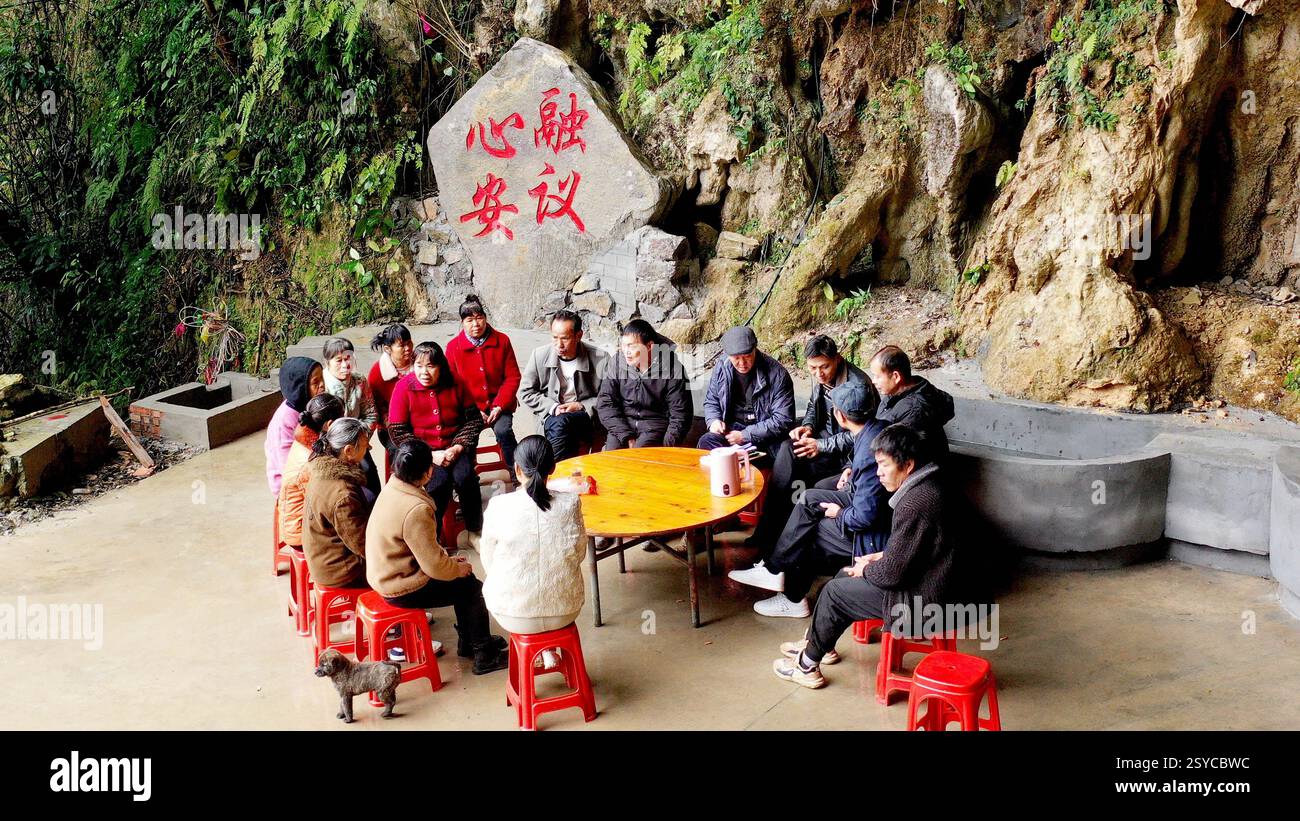 LIUZHOU, CHINA - FEBRUARY 28, 2025 - Villagers hold a meeting to ...