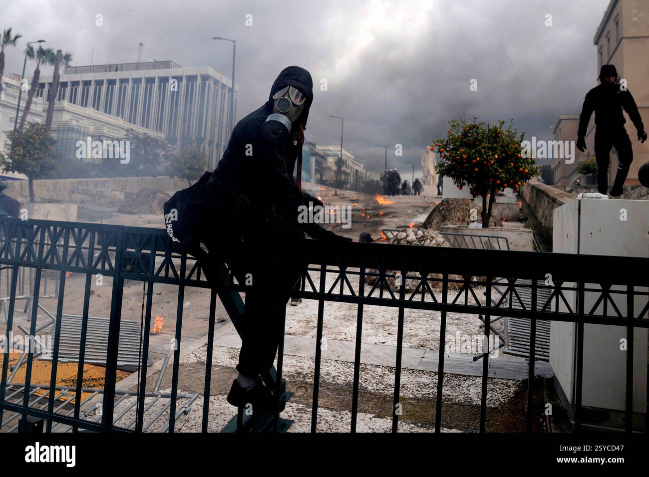 Protesters clash with the riots police outside of the parliament during ...