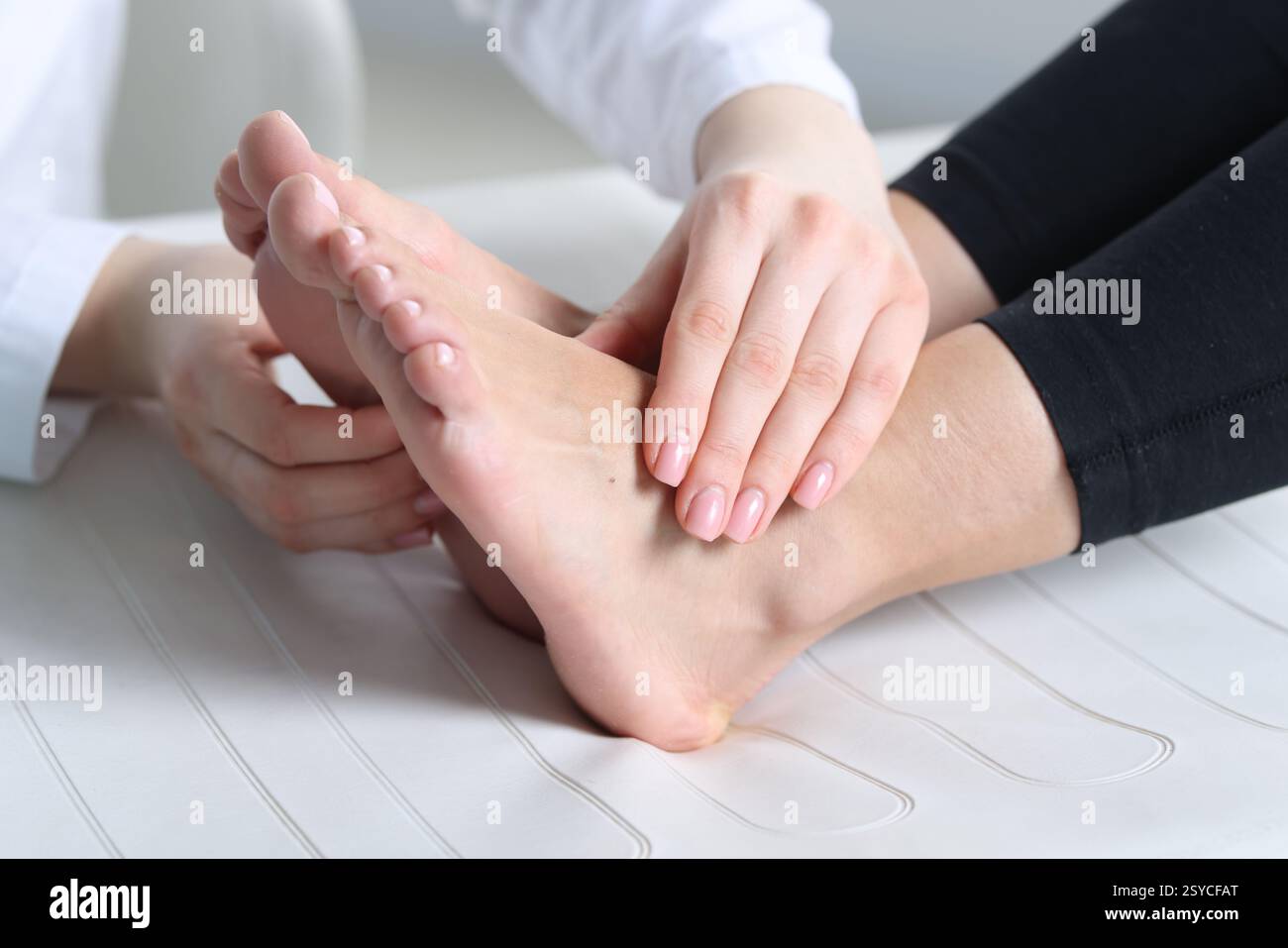 Doctor examining patient's foot in hospital, closeup Stock Photo - Alamy