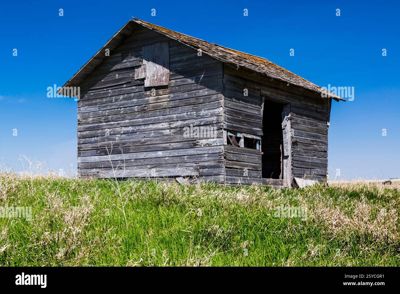 Small, old, wooden house with a slanted roof. The roof is missing ...