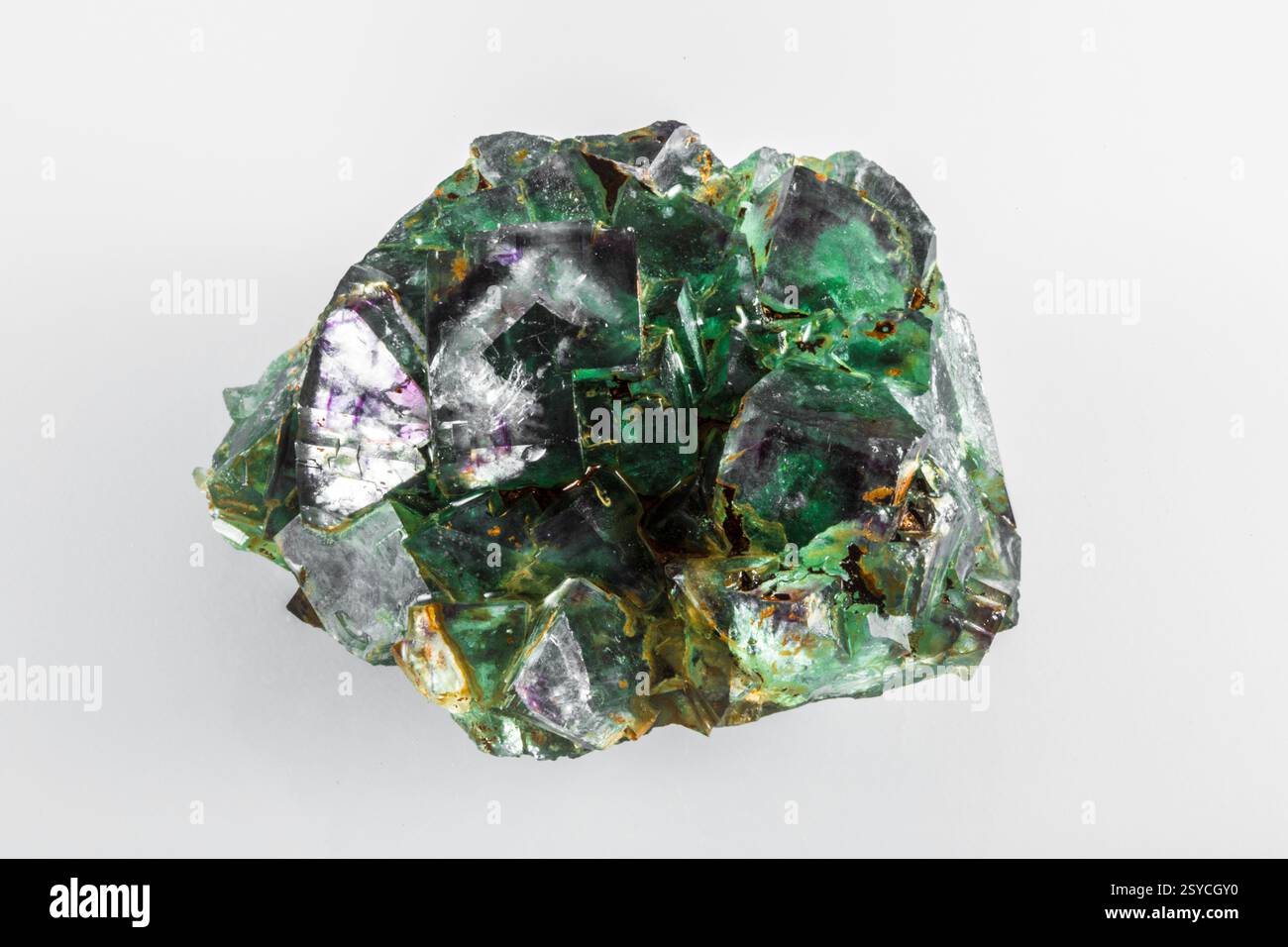 Green rock with purple and gold speckles. It is a type of crystal. It ...