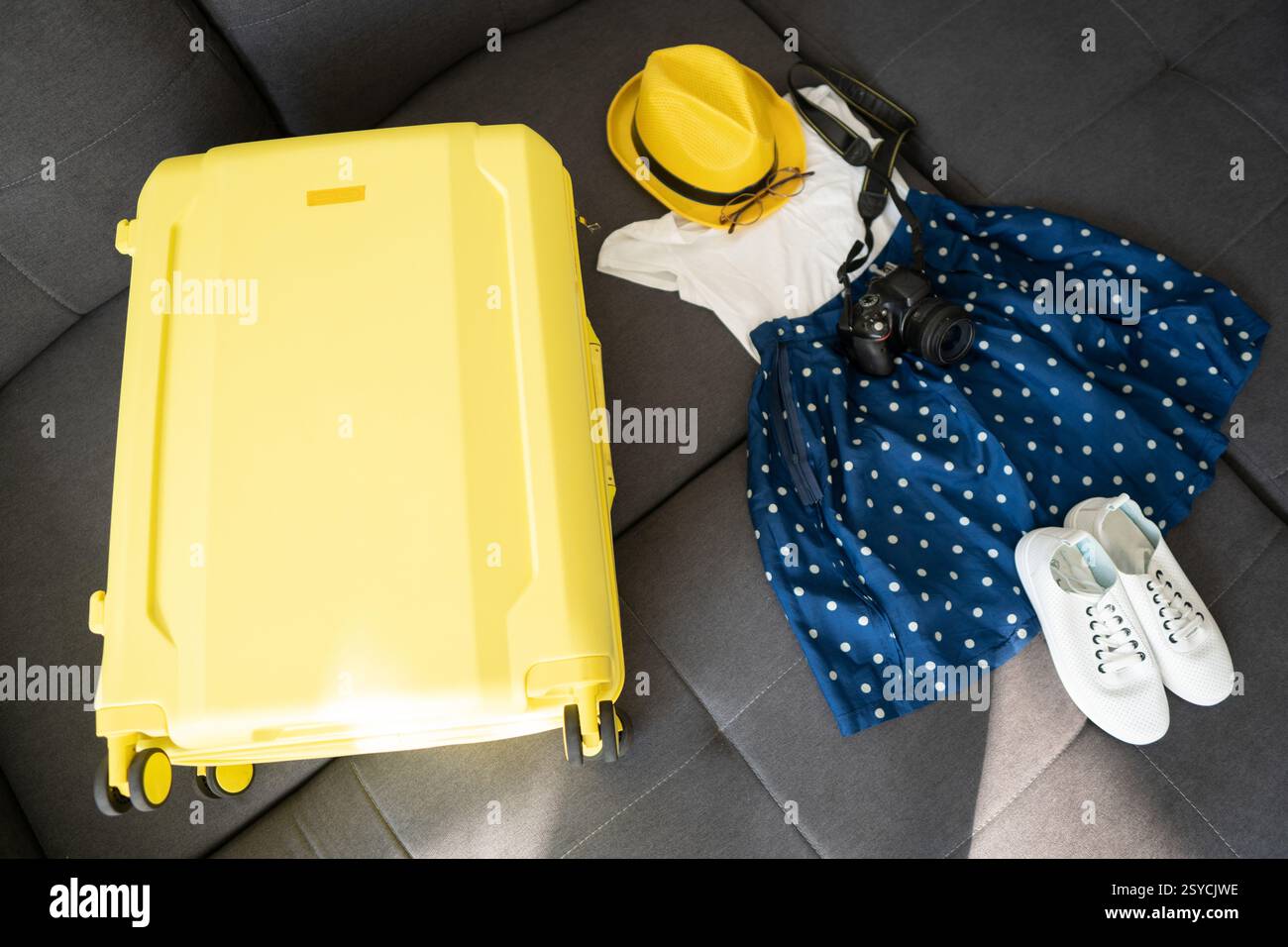 Flat Lay of Travel Essentials with a Yellow Suitcase Stock Photo - Alamy