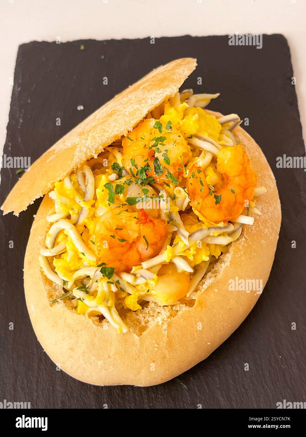 Tapa made of gulas, prawns and eggs in bread. Spain Stock Photo - Alamy