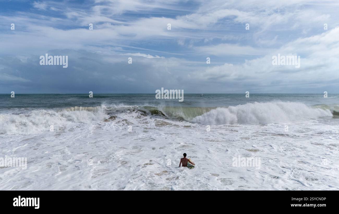 Aerial Drone Shot Looking down on a group of surfers in the caribbean ...