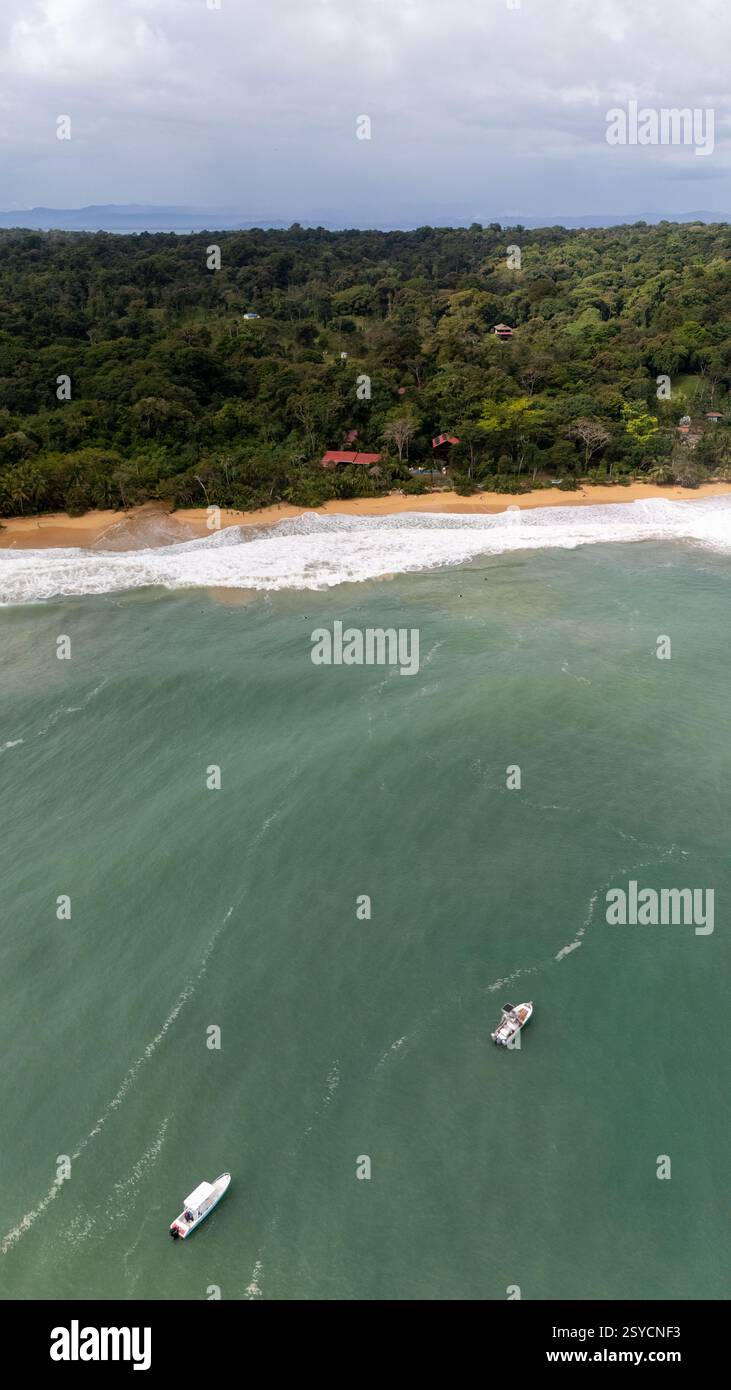Aerial Drone Shot Looking down on a group of surfers in the caribbean ...