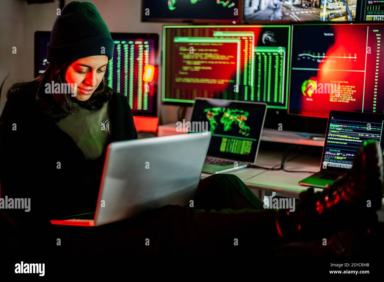 Hacker Breaking Into Corporate Network Using Laptop And Multiple