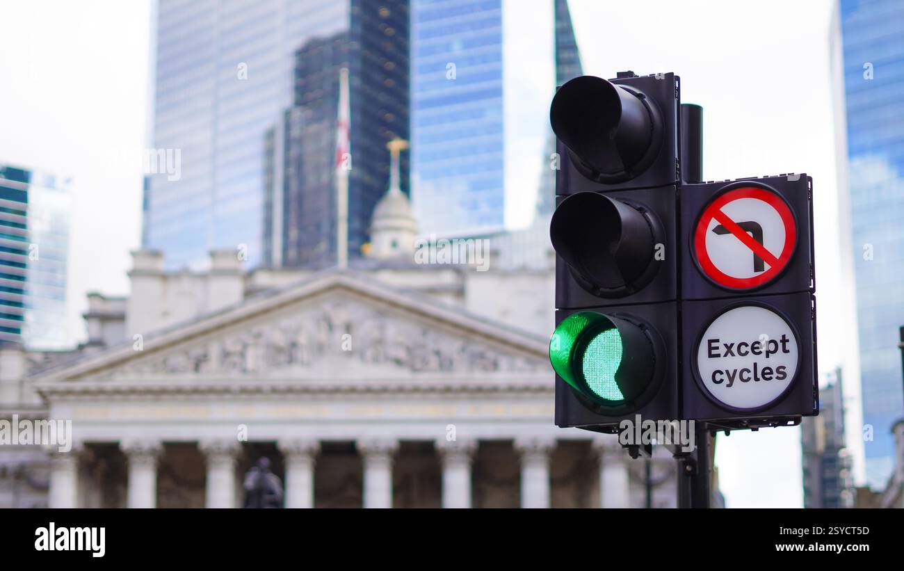 Traffic lights on a European street with pedestrians and tall glass ...