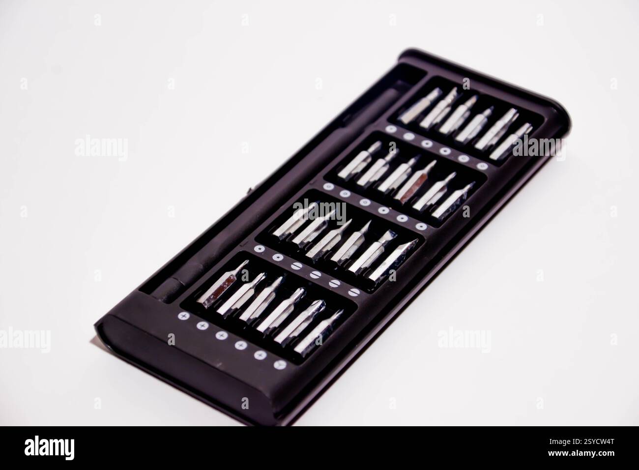 Set of screwdriver bits in a black box on a white background. Tools ...