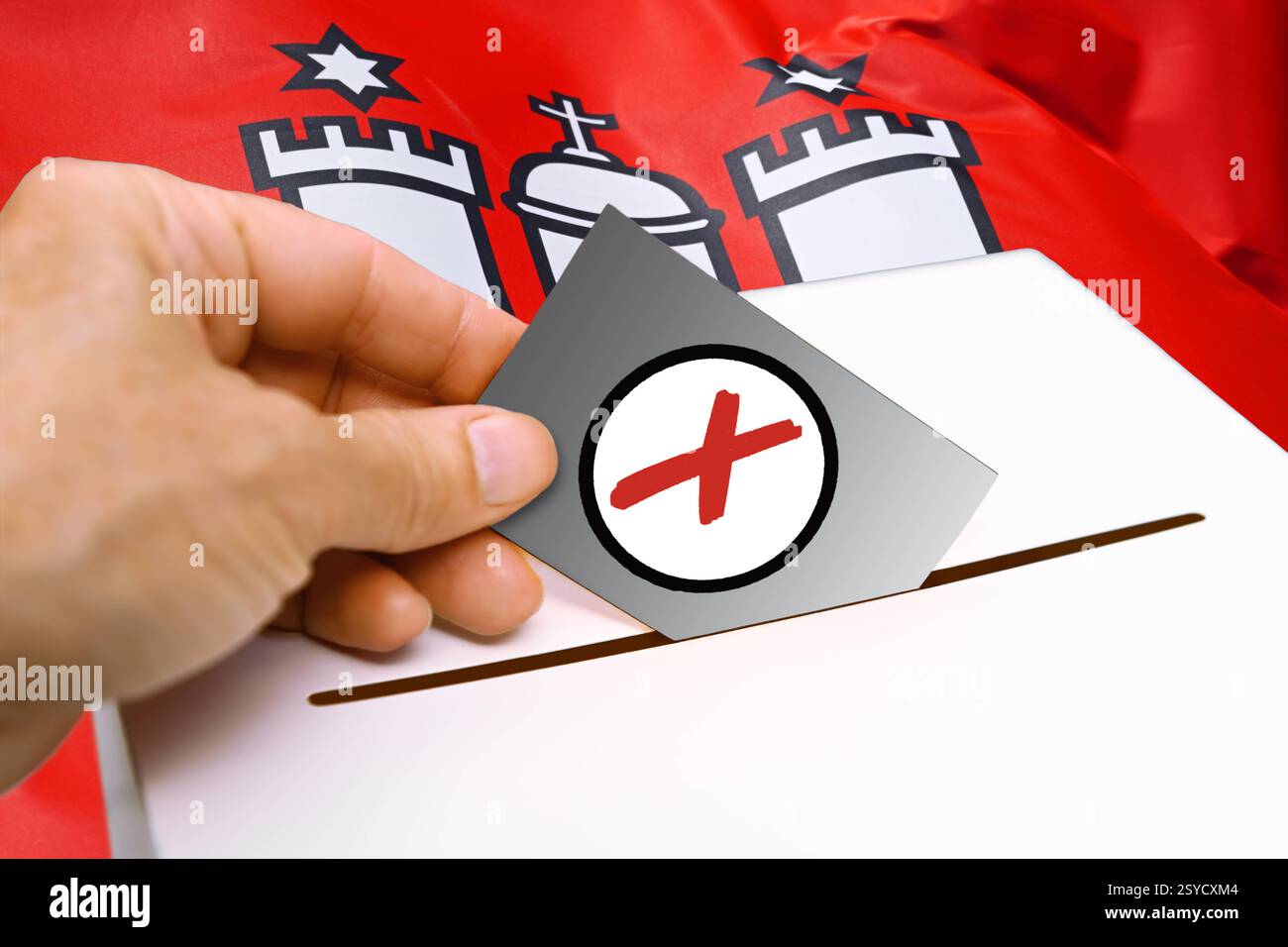 FOTOMONTAGE, Zettel mit Wahlkreuz wird in eine Wahlurne geworfen ...