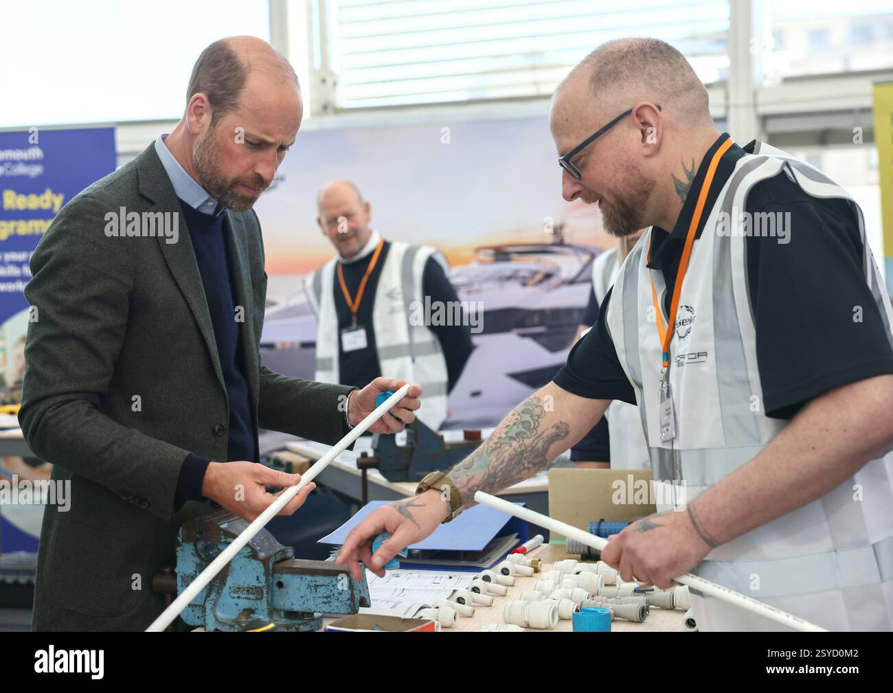 The Prince of Wales is shown boat building techniques by Trainee Boat ...