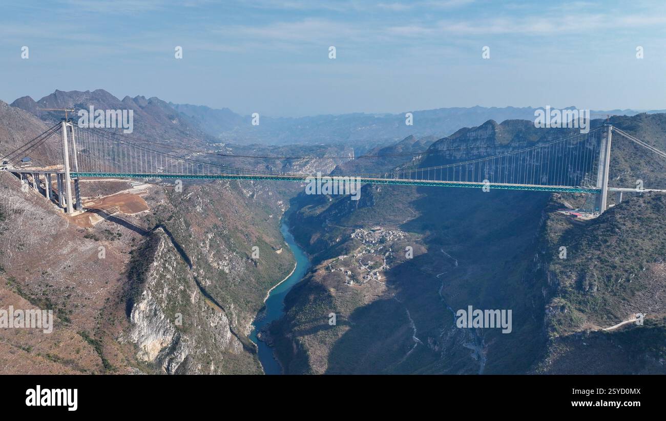 QIANNAN, CHINA - FEBRUARY 28, 2025 - The Huajiang Canyon Bridge under ...
