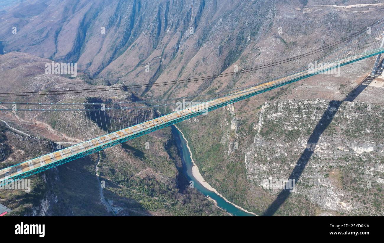 QIANNAN, CHINA - FEBRUARY 28, 2025 - The Huajiang Canyon Bridge under ...